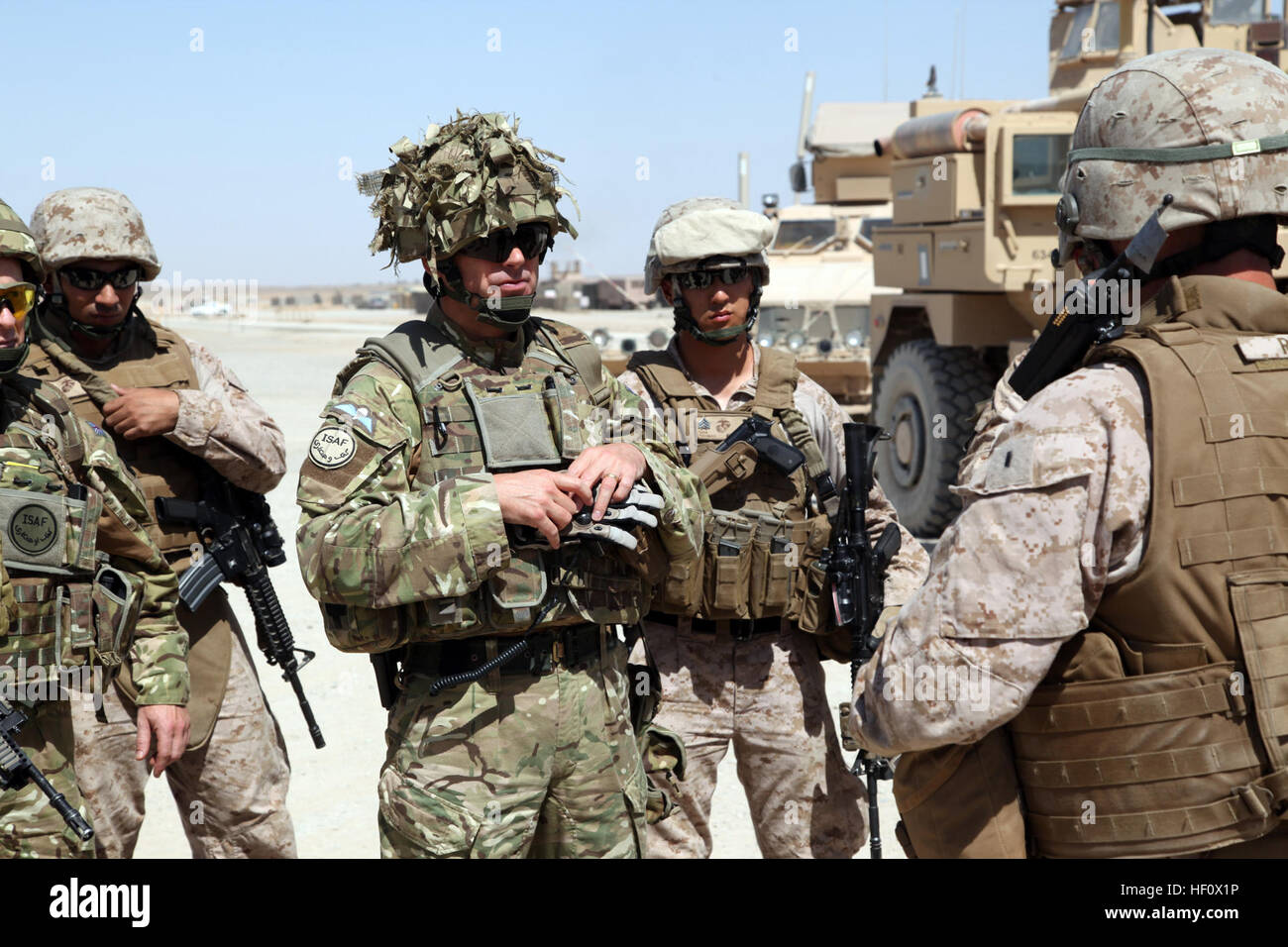 British Army Brig. Stuart Skeates, center, deputy commander of Regional ...