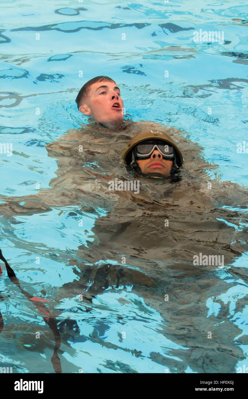 Lance Cpl. Keegan L. Cooley performs the armpit tow, one of three ...