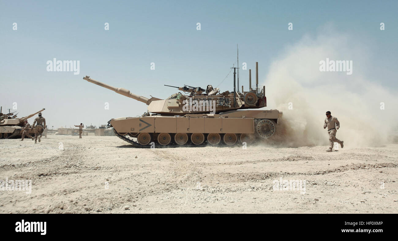 A U.S. Marine Corps M1A1 Abrams tank finishes refueling Combat Outpost ... A U.S. Marine Corps M1A1 Abrams tank finishes refueling Combat Outpost ...