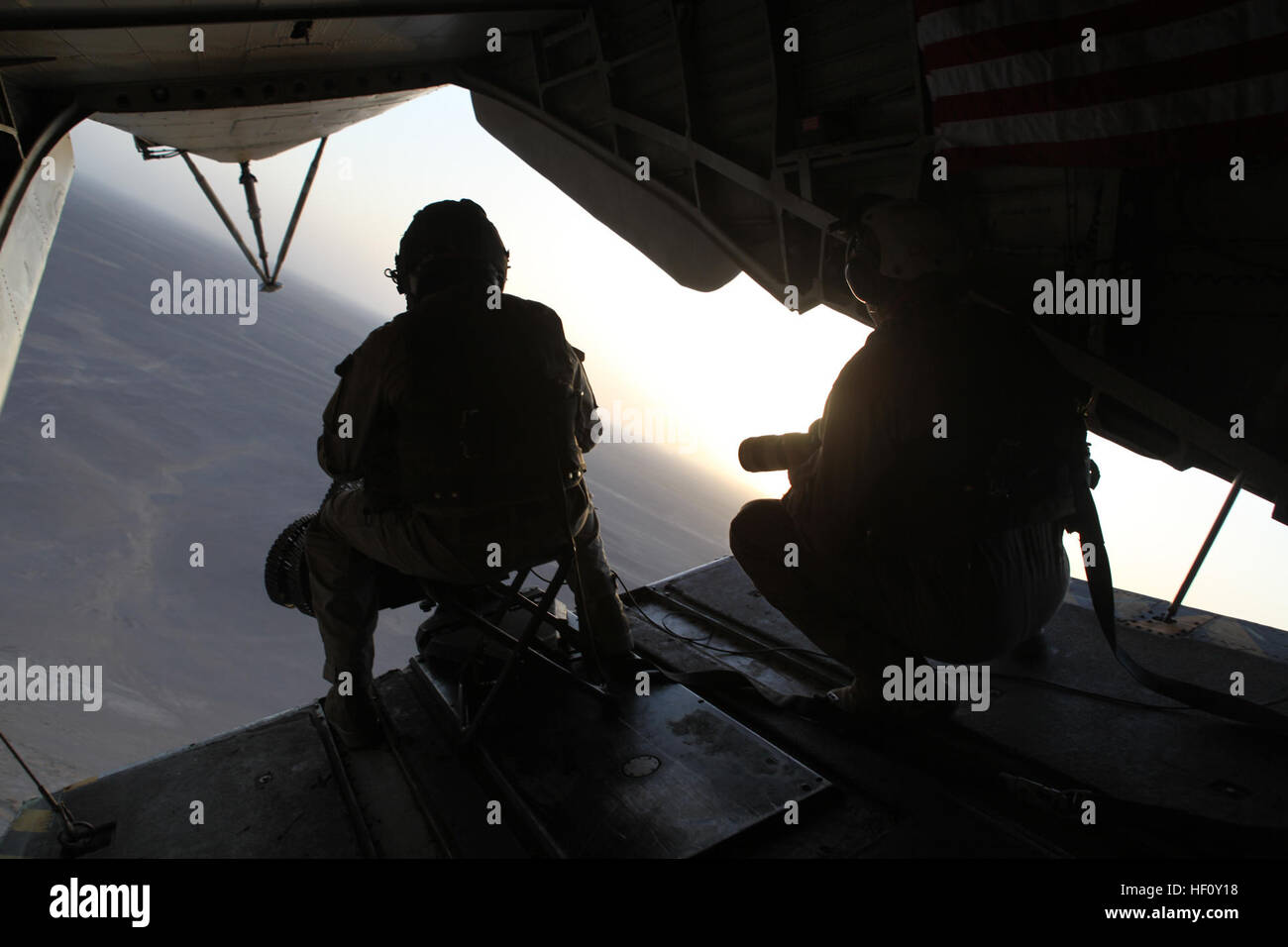 A crew chief with Marine Heavy Helicopter Squadron 362 sits at the ...