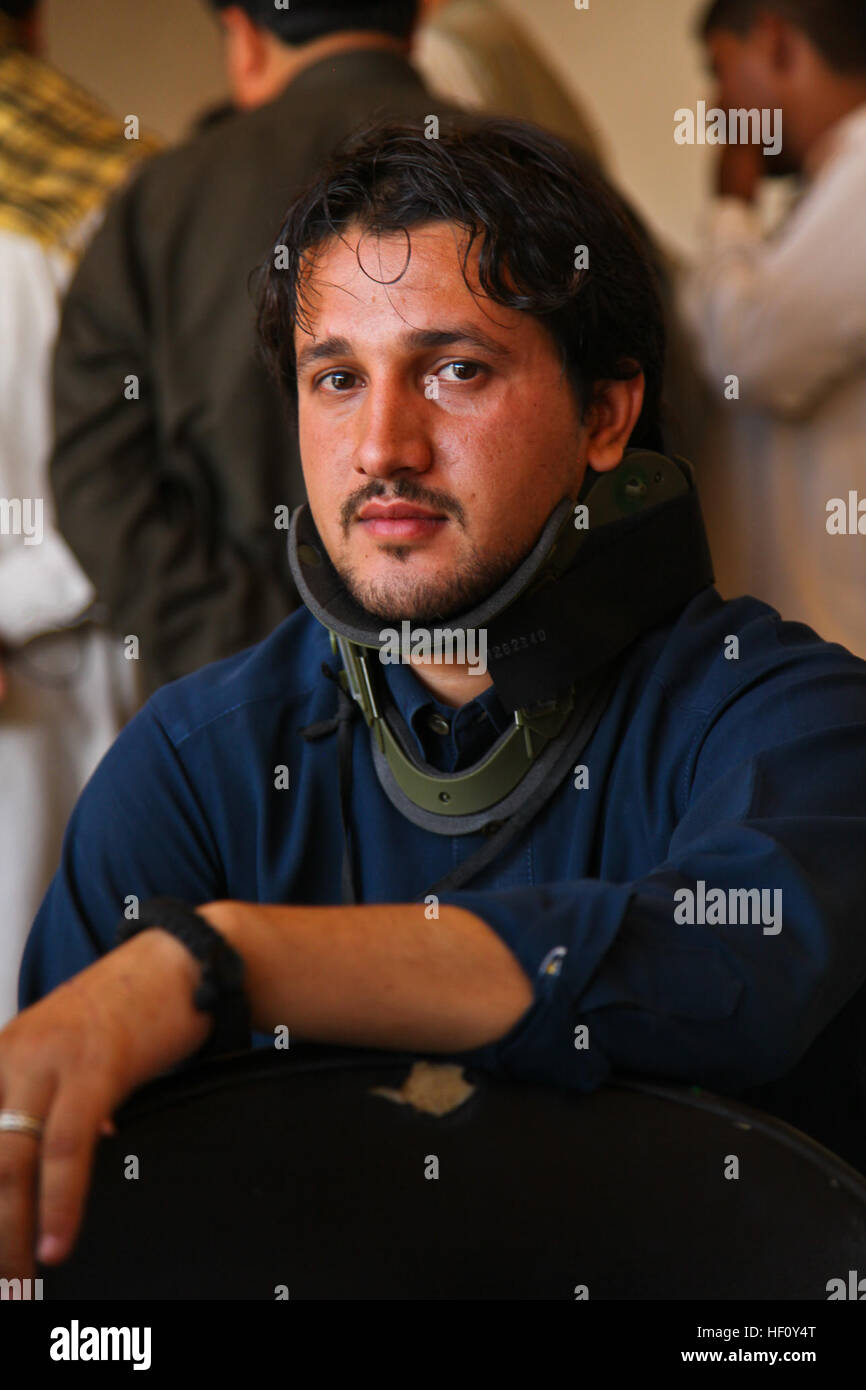 An Afghan shopkeeper poses for a photo during a meeting at Forward ...