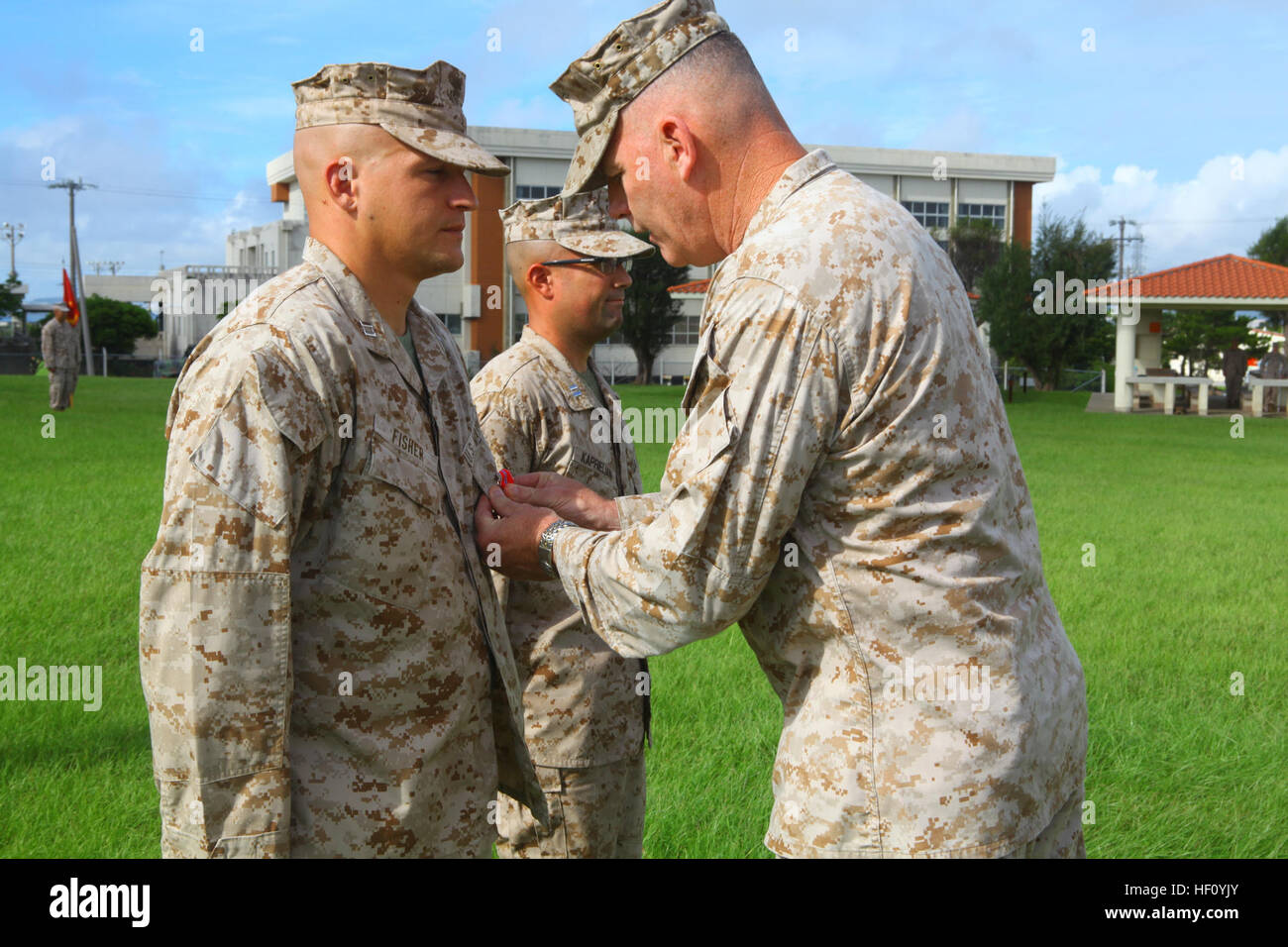 Brig. Gen. Niel E. Nelson pins the Bronze Star onto Capt. Aaron F ...