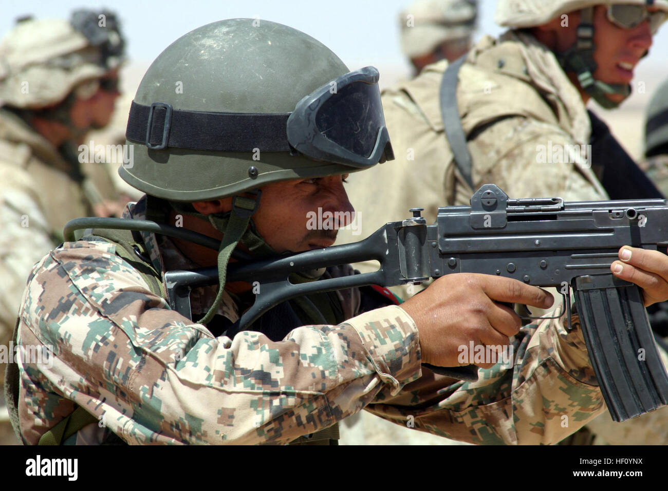 A Jordanian soldier fires his rifle during live-fire training with ...