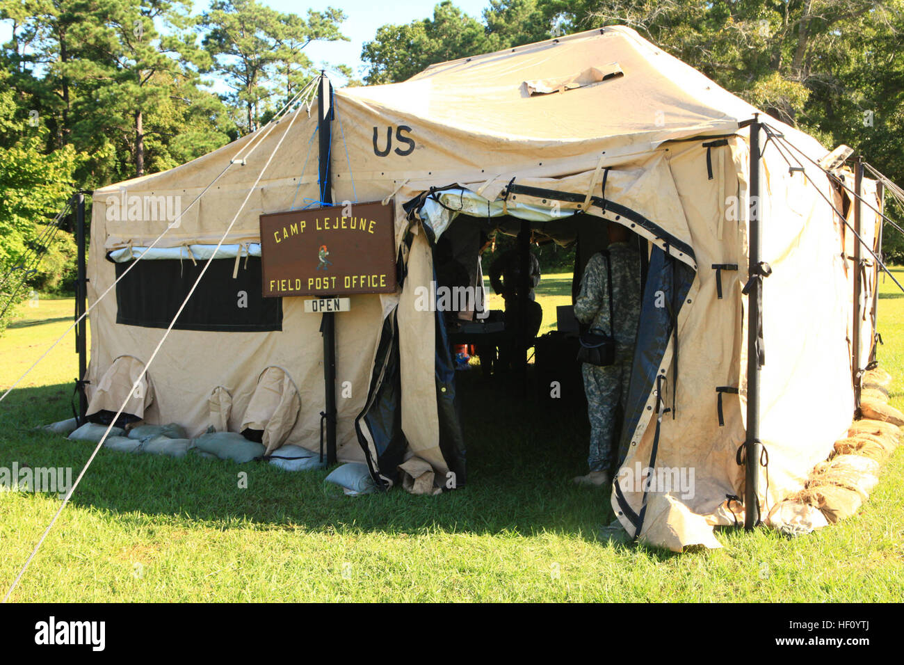 Marines and soldiers train inside a field-expedient post office aboard ...