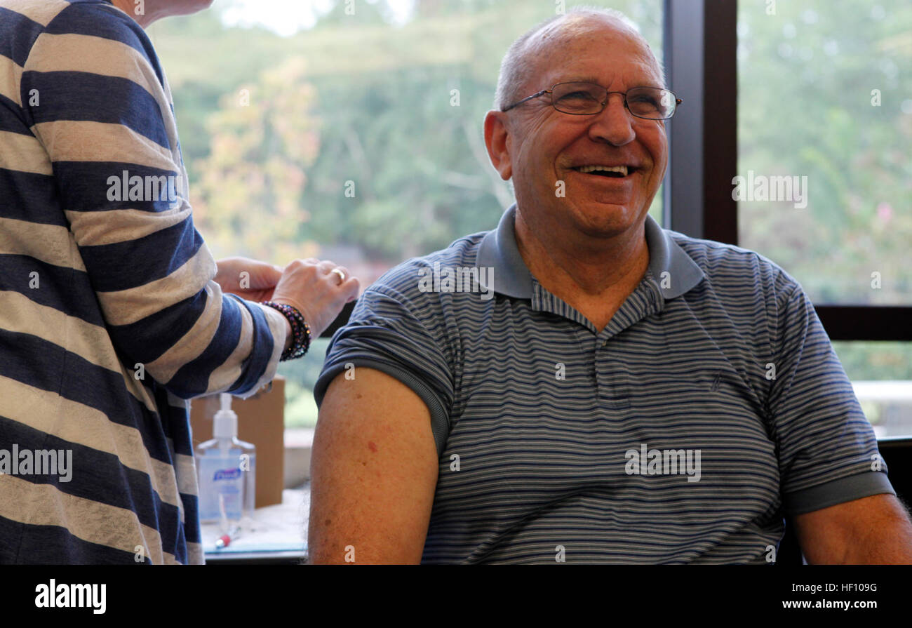 Patrick E. Libby, a retired Master Sgt. receives a flu shot during the ...