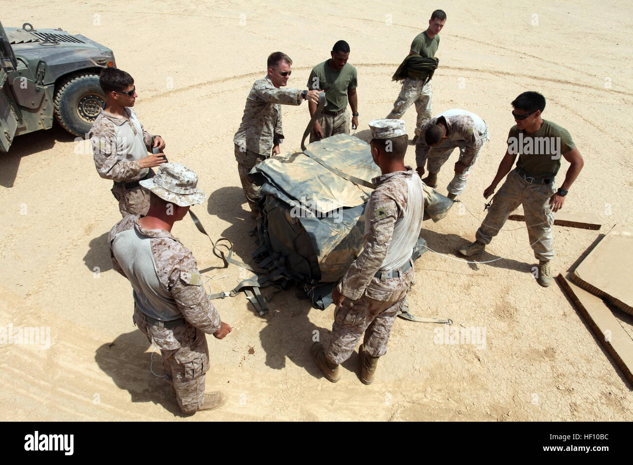 Marines with the 24th Marine Expeditionary Unit unpack a container ...