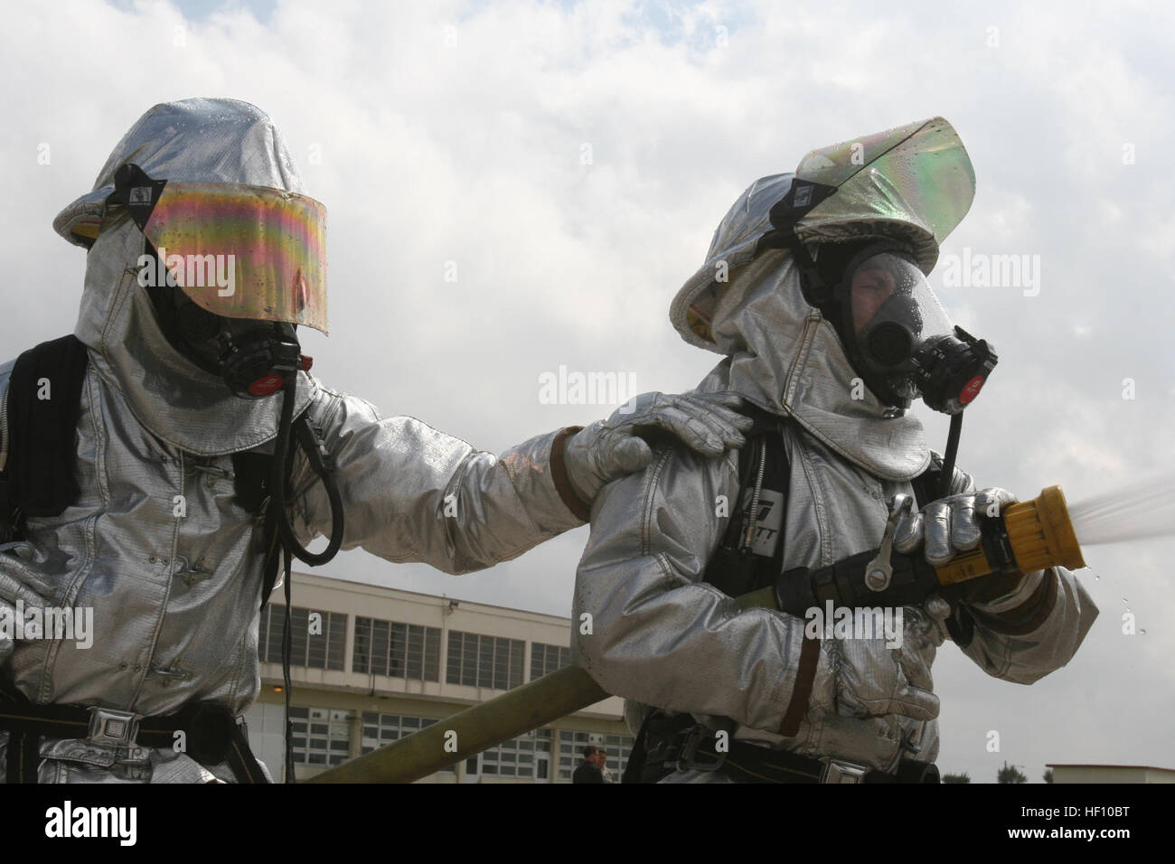 Aircraft rescue and firefighting Marines demonstrate proper fire ...