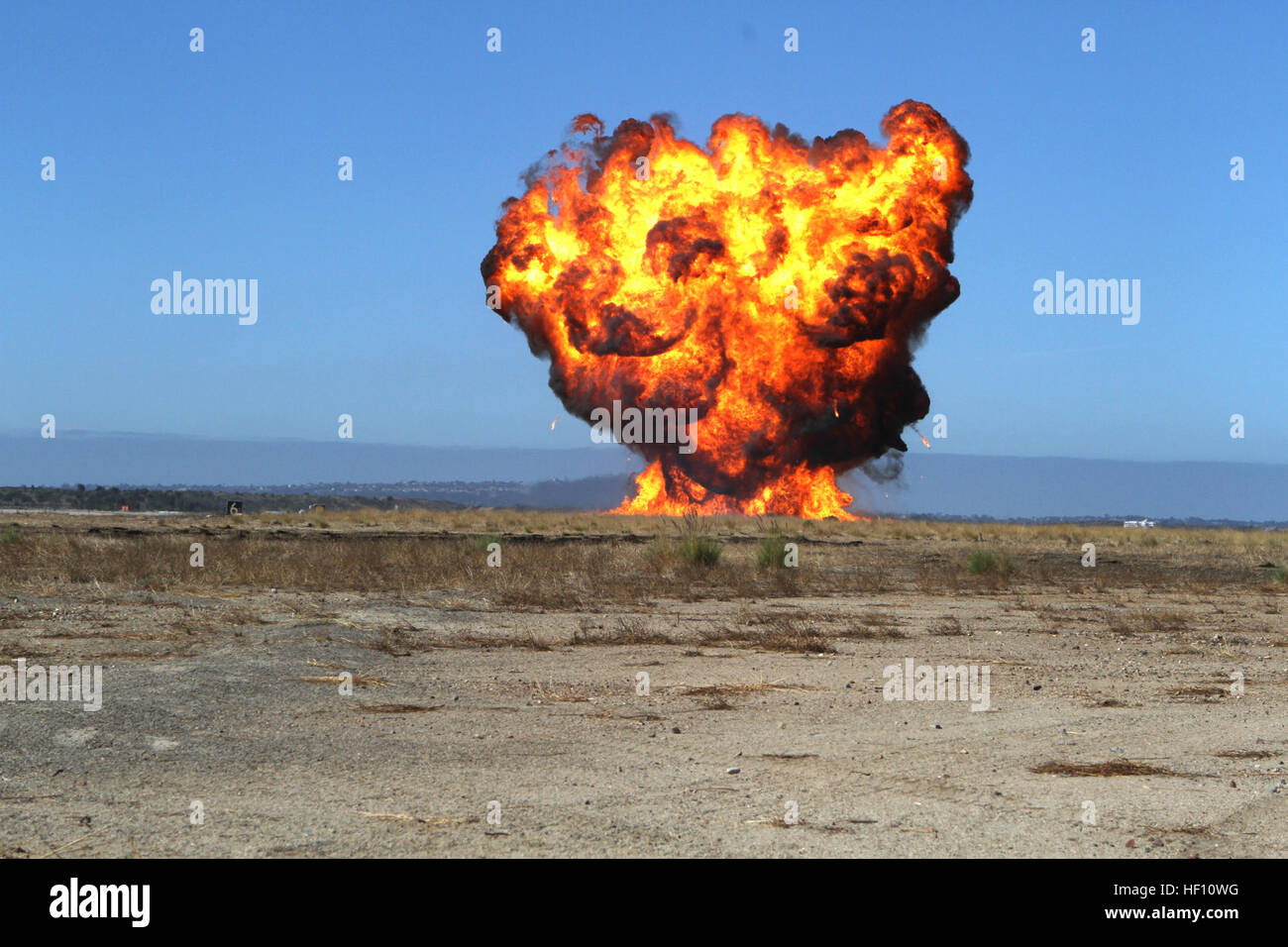 An explosive goes off on the flight line during a simulated napalm ...