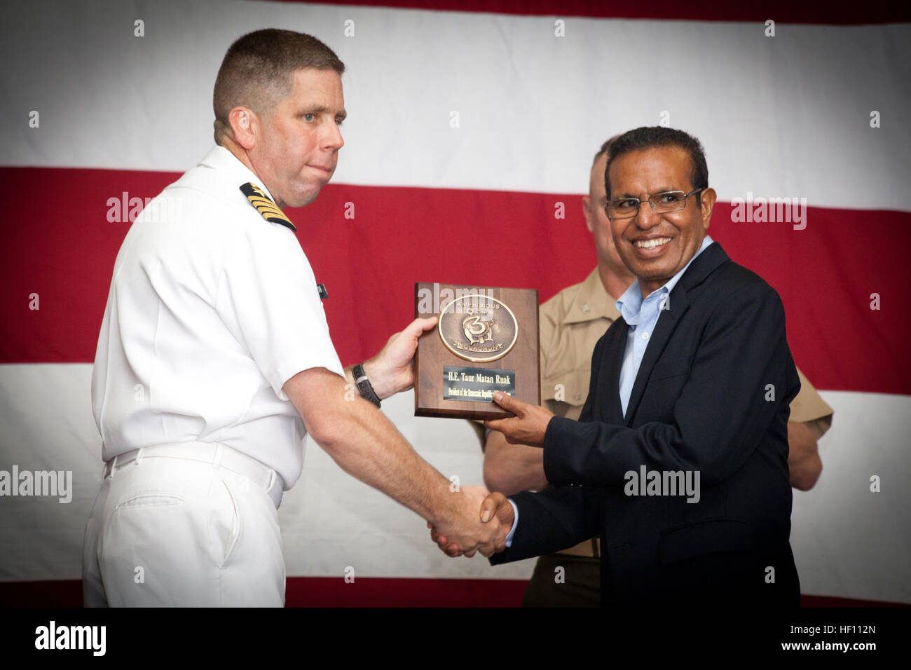 Capt. Mark Sakaguchi, commander of Amphibious Squadron 3, gives Taur ...