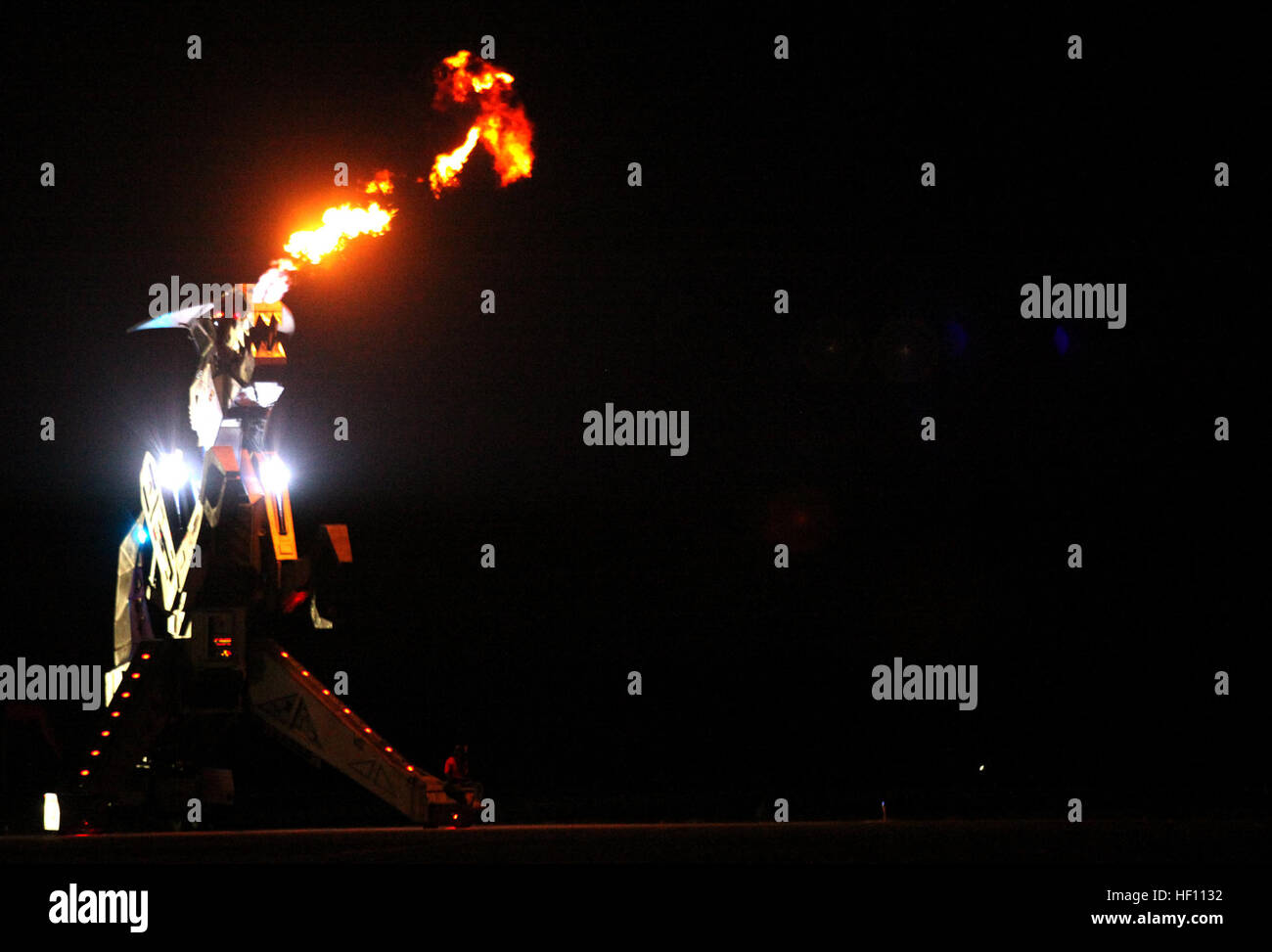 Robosaurus, a dinosaur robot, lights up the night sky during the 2012 ...