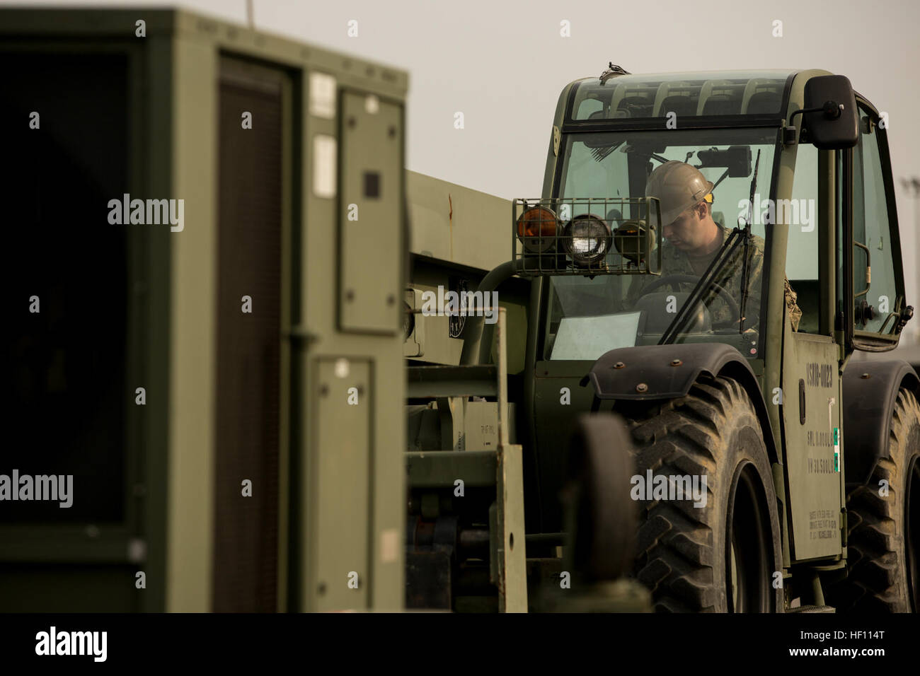 A U.S. Navy Construction Electrician secures equipment aboard the USNS ...