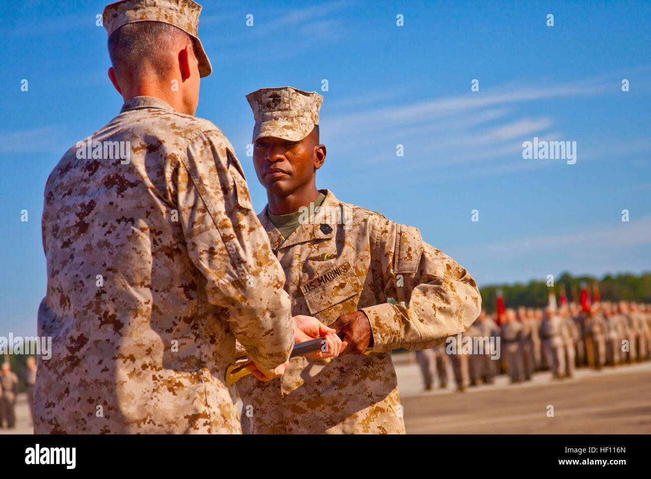 Sgt. Maj. Christopher G. Robinson, right, receives the noncommissioned ...