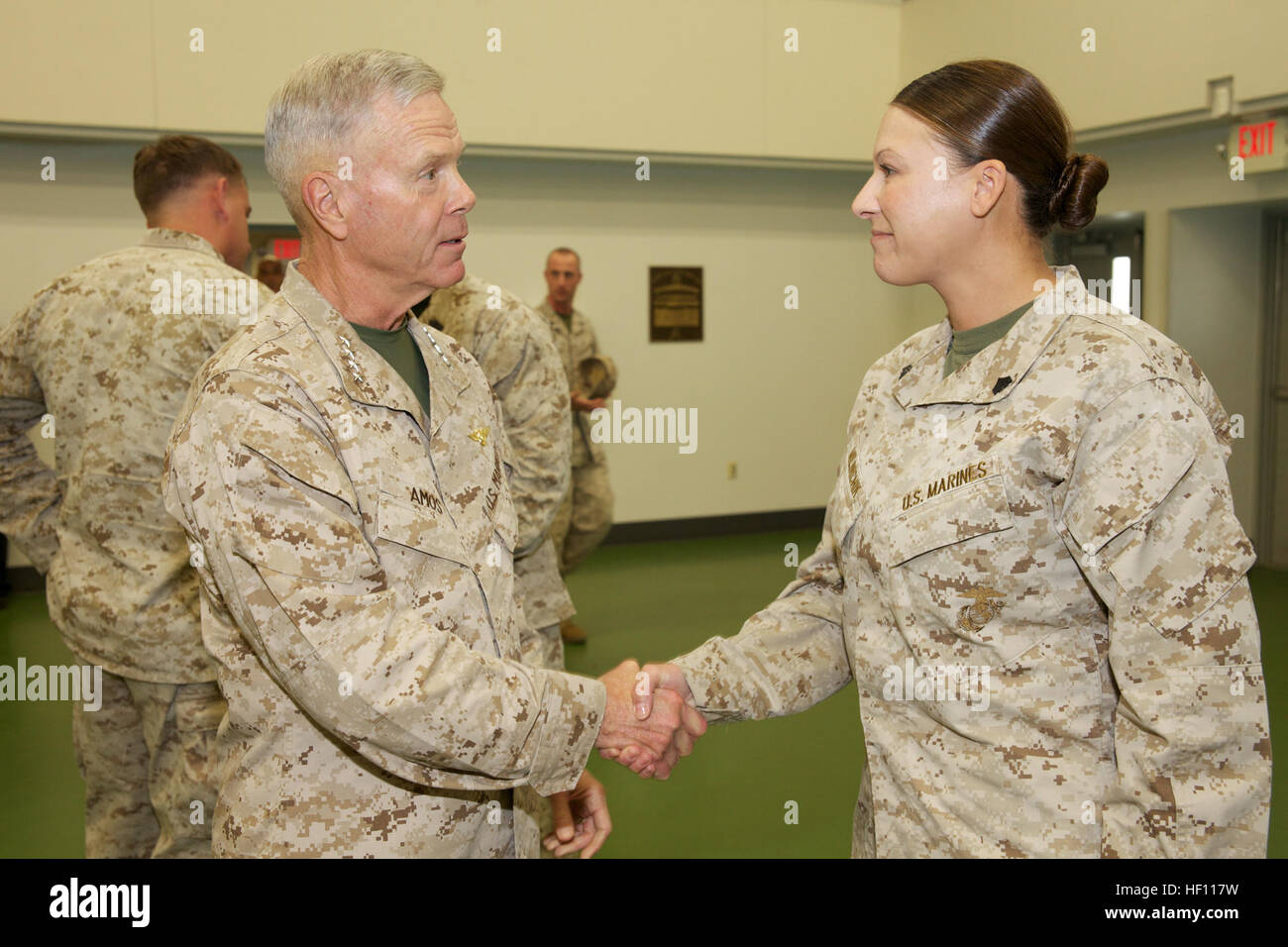 The Commandant of the Marine Corps, Gen. James F. Amos, left, greets a ...
