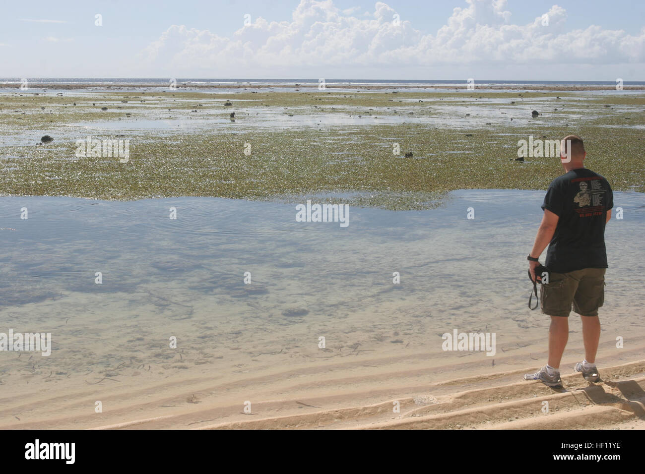Capt. Benjamin T. Taggart collects sand from White Beach on Peleliu ...