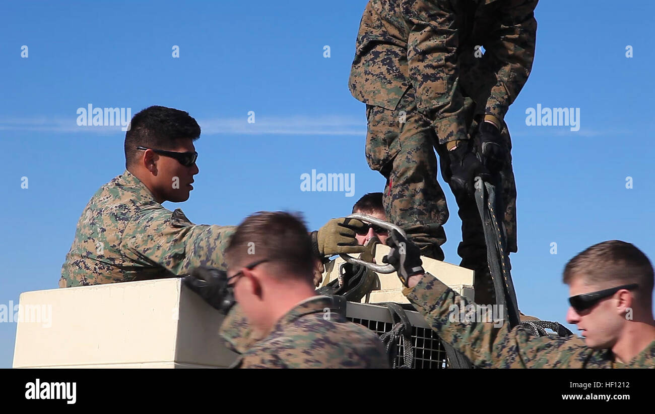 Marines from CLB-26, 26th MEU, prepare a generator for airlift by MH ...