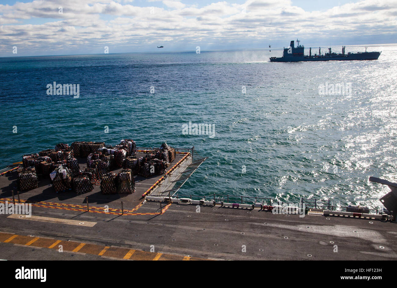 Cargo is staged on an elevator aboard USS Wasp during a resupply at sea ...