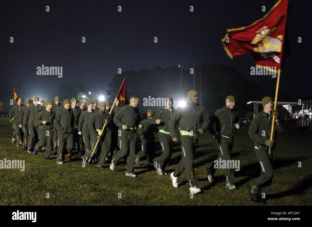 Marines with 2nd Marine Logistics Group run in a formation during an ...