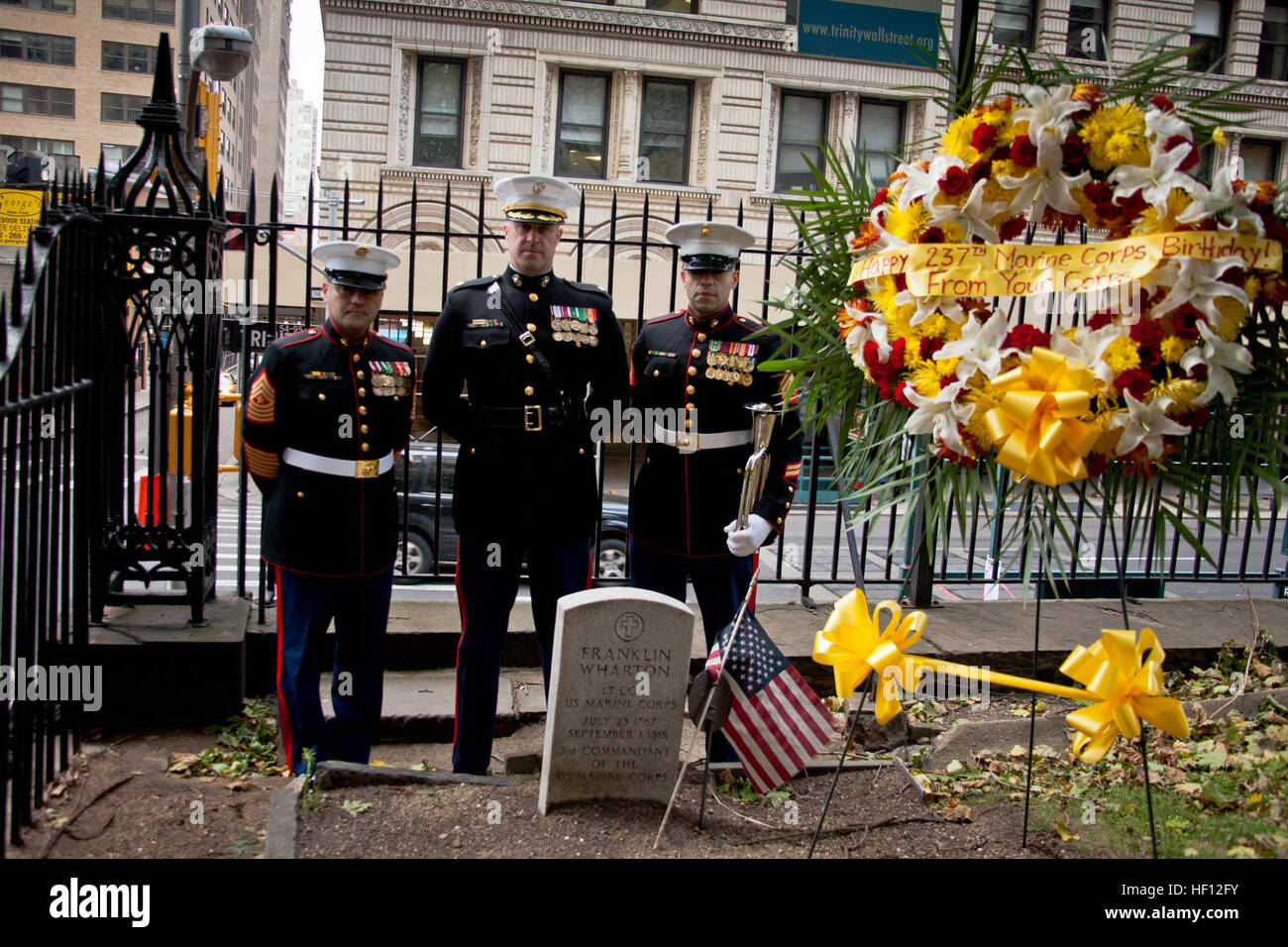 Marines from the 6th Communication Battalion lay a wreath at the grave ...
