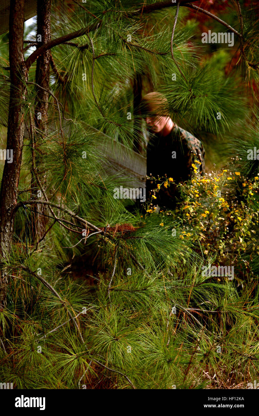 A U.S. Marine, with 2nd Combat Engineer Battalion, sets up C4 ...