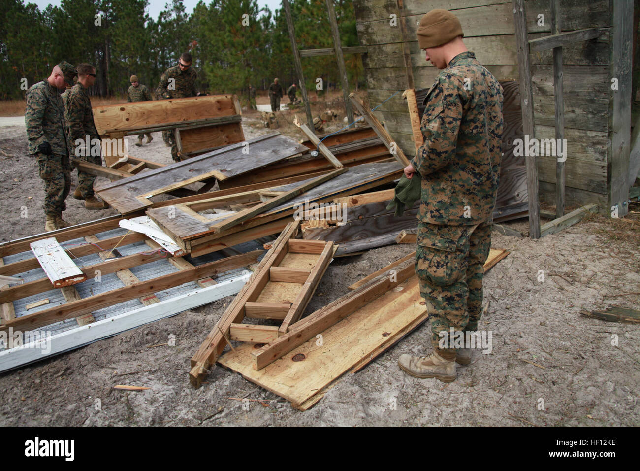 U.S. Marines with 2nd Combat Engineer Battalion, observe the aftermath ...