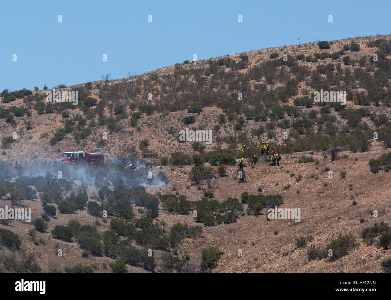 Firefighters with the Miramar Fire Department and the Laguna Hotshots ...