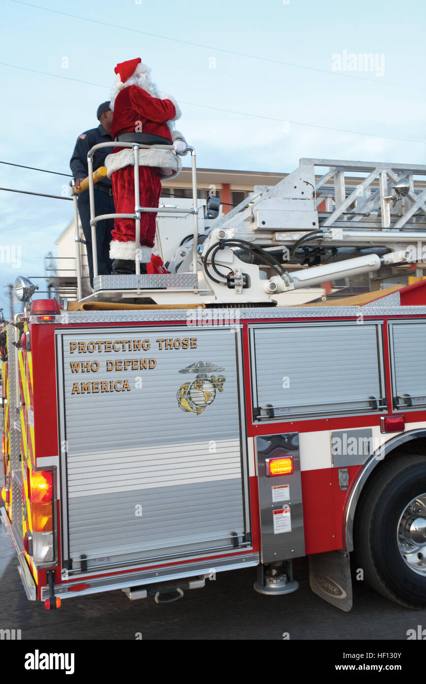 Santa Claus arrives to the "All Wrapped Up" holiday event on top of a ...