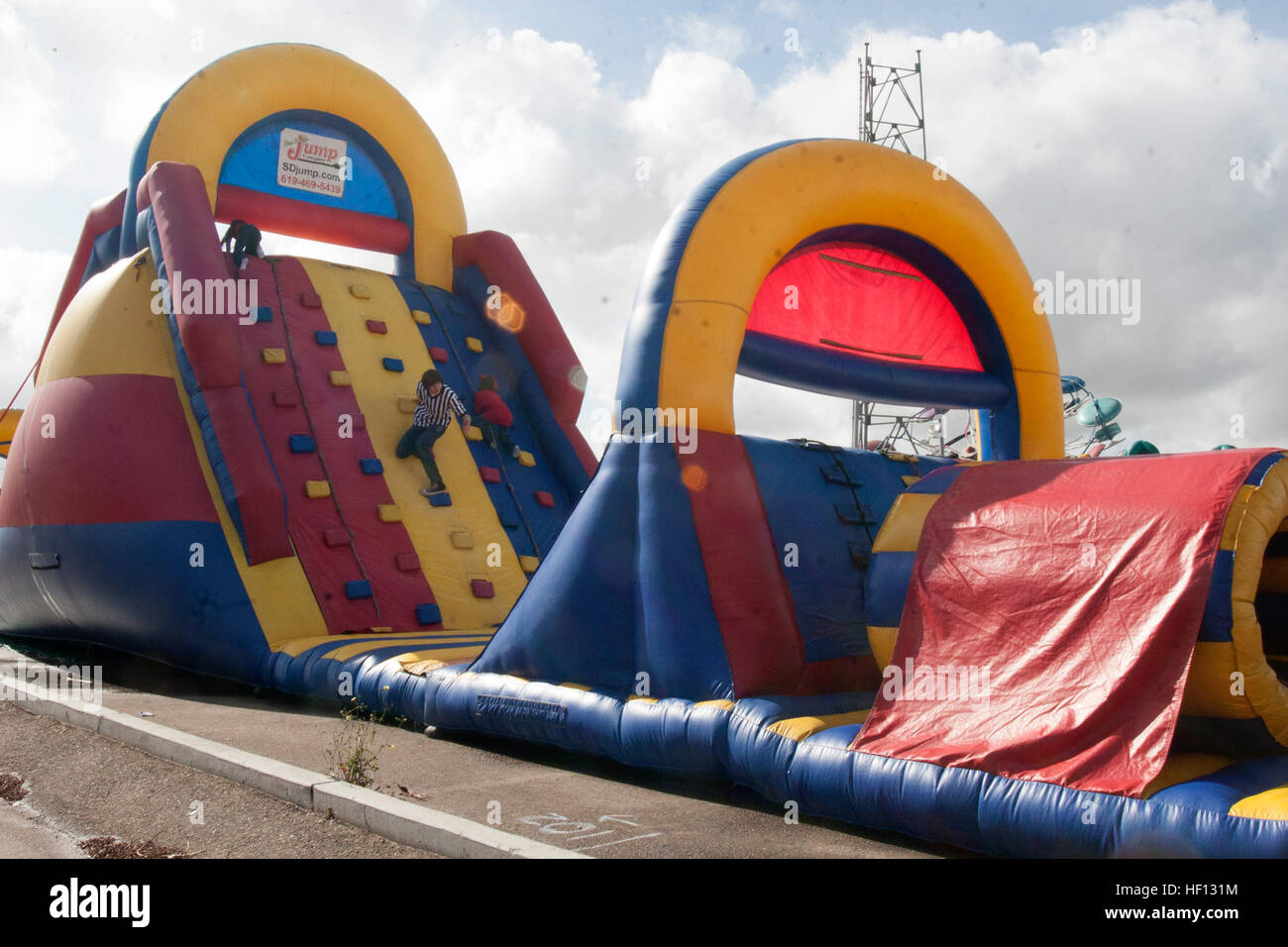 Children race through a blow up obstacle course during the Children's ...