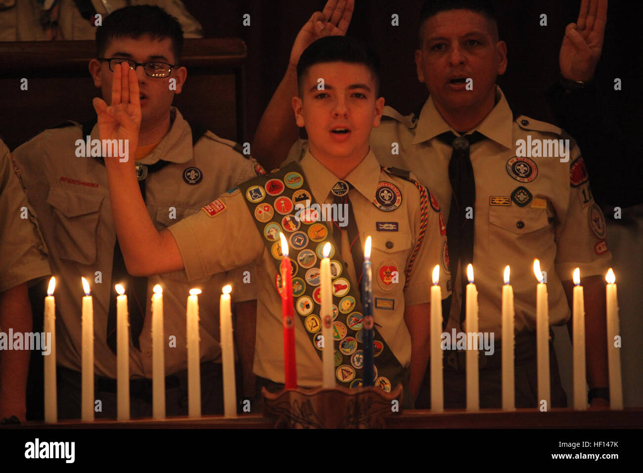 Gabriel Vasquez recites the Boy Scout oath with members of his troop ...