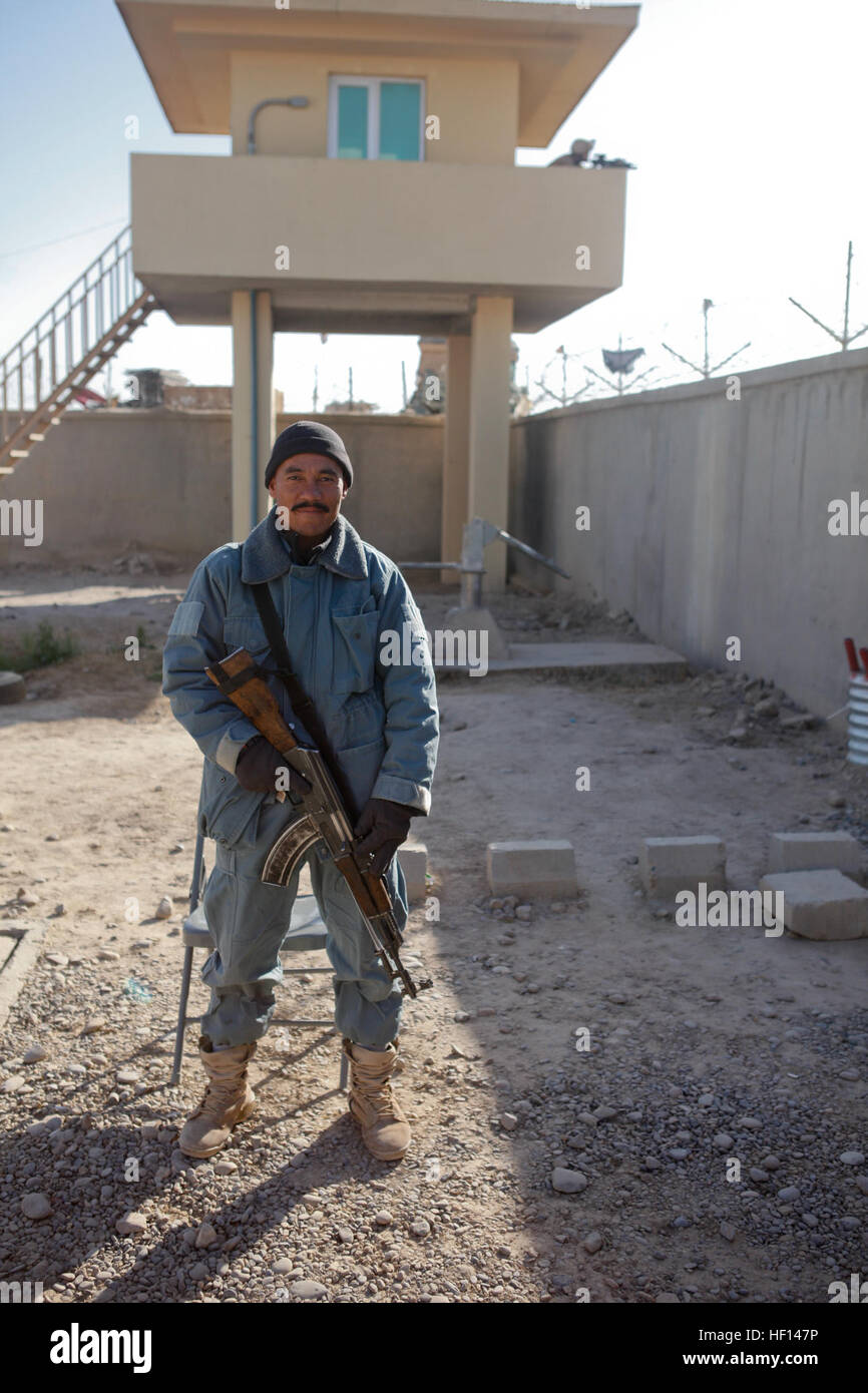 An Afghan National Police (ANP) soldier stands guard at an ANP compound ...