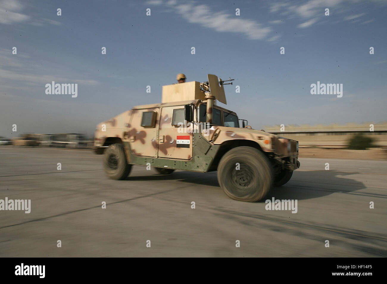Iraqi soldiers drive on one of their new armored humvees. The Iraq's ...