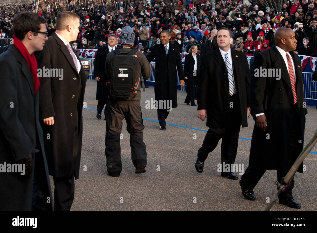 President Barack Obama and first lady Michelle Obama pass the official ...