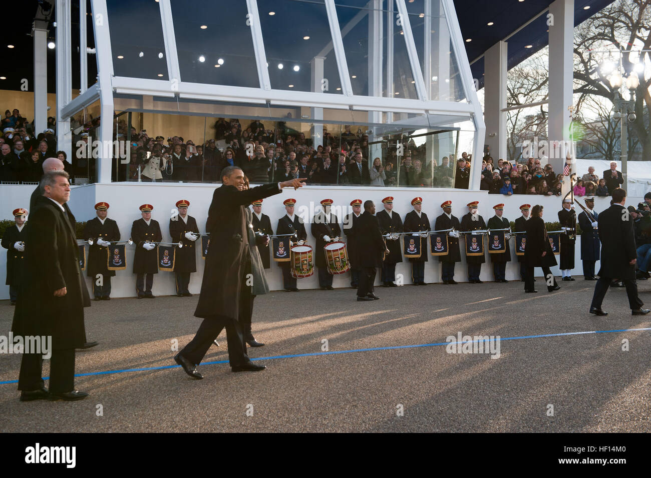 President Barack Obama and first lady Michelle Obama pass the official ...