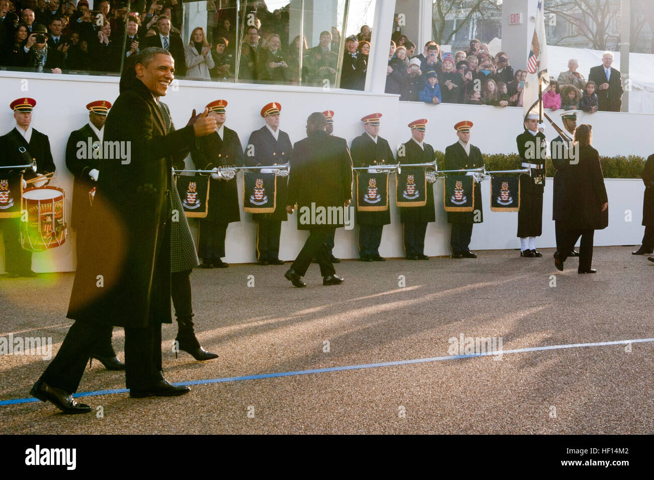 President Barack Obama and first lady Michelle Obama pass the official ...