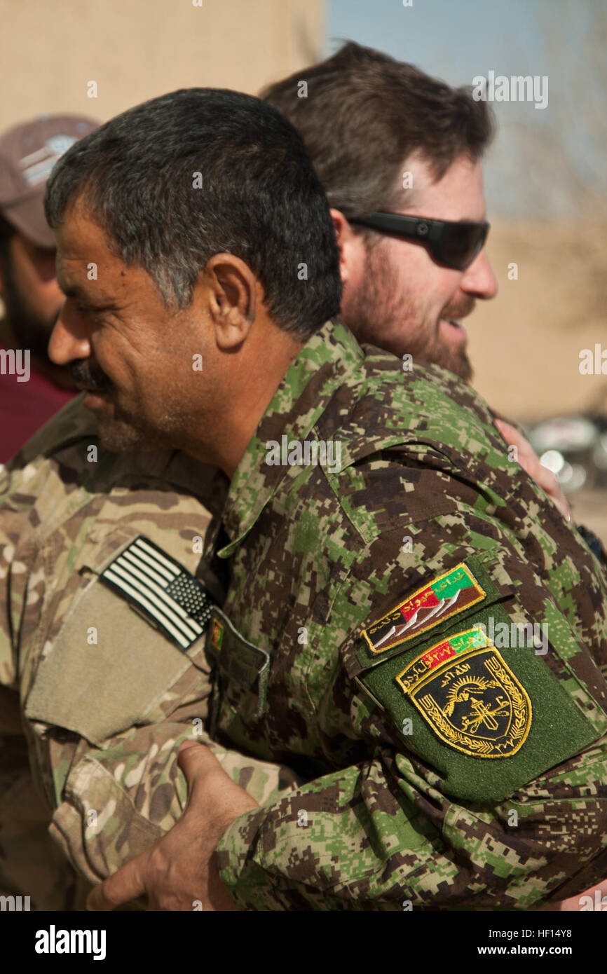 An Afghan National Army commander, front, embraces a U.S. Service ...