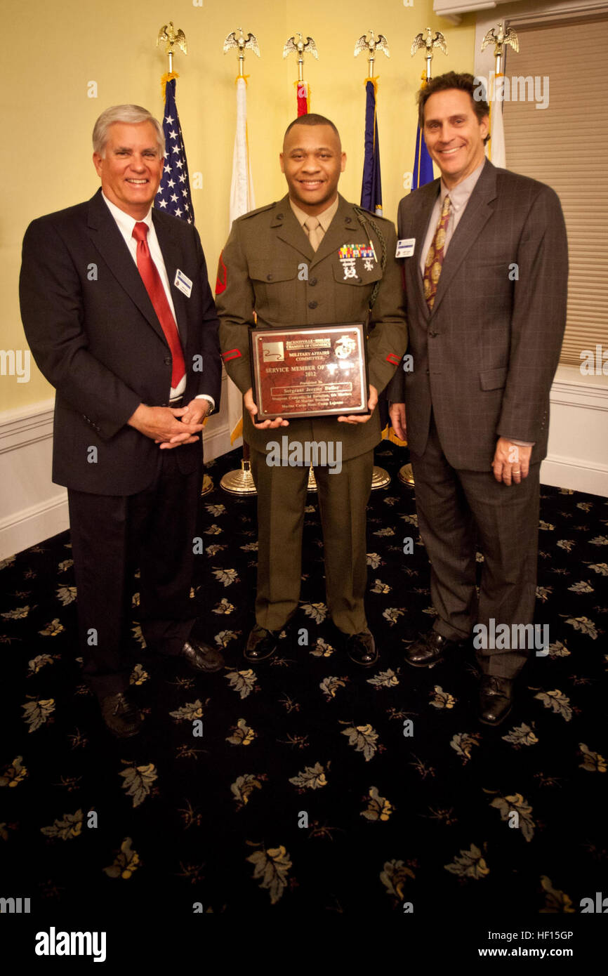 Sergeant Jeremy Butler (center) was selected as the Jacksonville-Onslow ...