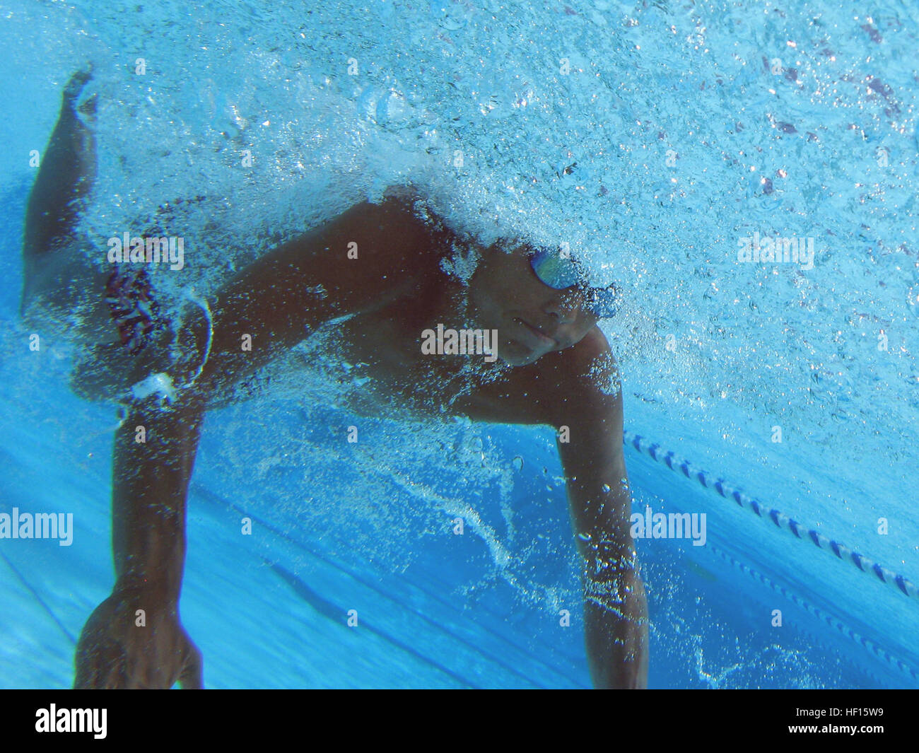 A competitor flies through the water during the 20-yard butterfly race ...