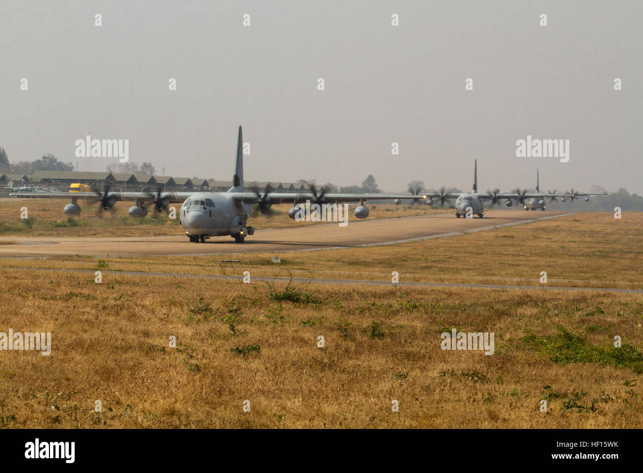 Three U.S. Marine Corps KC-130J Hercules taxi on the runway at Wing One ...