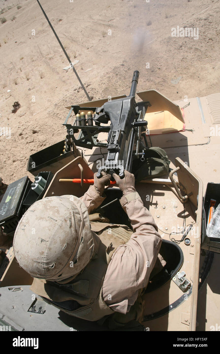 A 40 mm grenade flies from the muzzle of a MK-19 automatic grenade ...