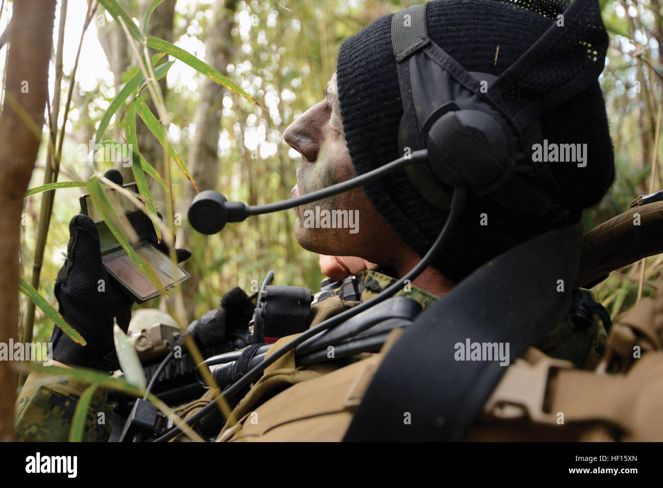 A reconnaissance man with 3rd Reconnaissance Battalion checks his ...