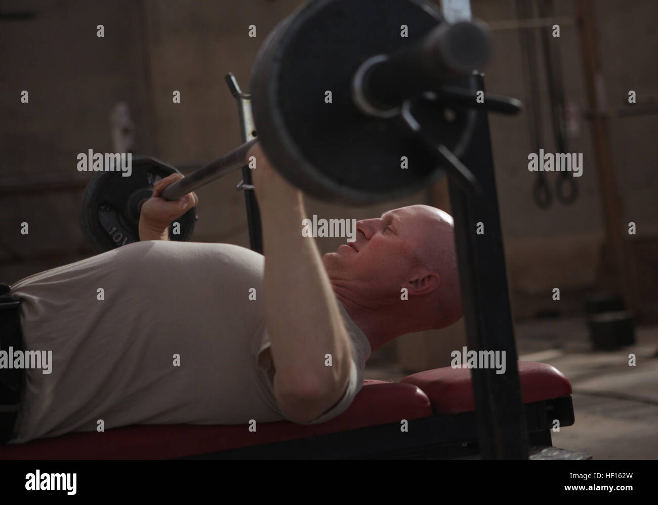 Petty Officer First Class Timothy Sheller lifts weights at the outdoor ...