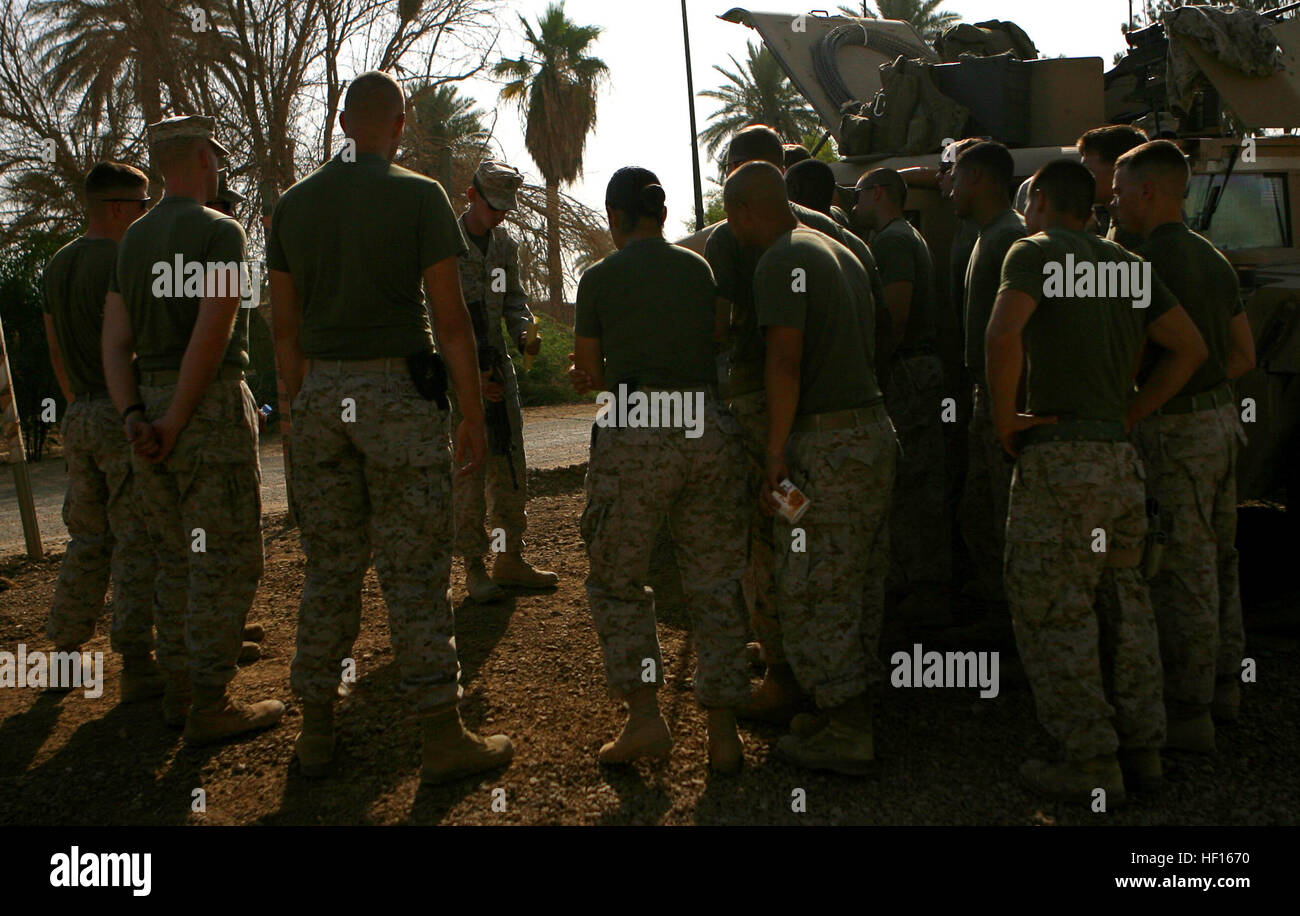 In the scorching Iraqi sunlight, Sgt. Brian P. Faulk prepares his ...
