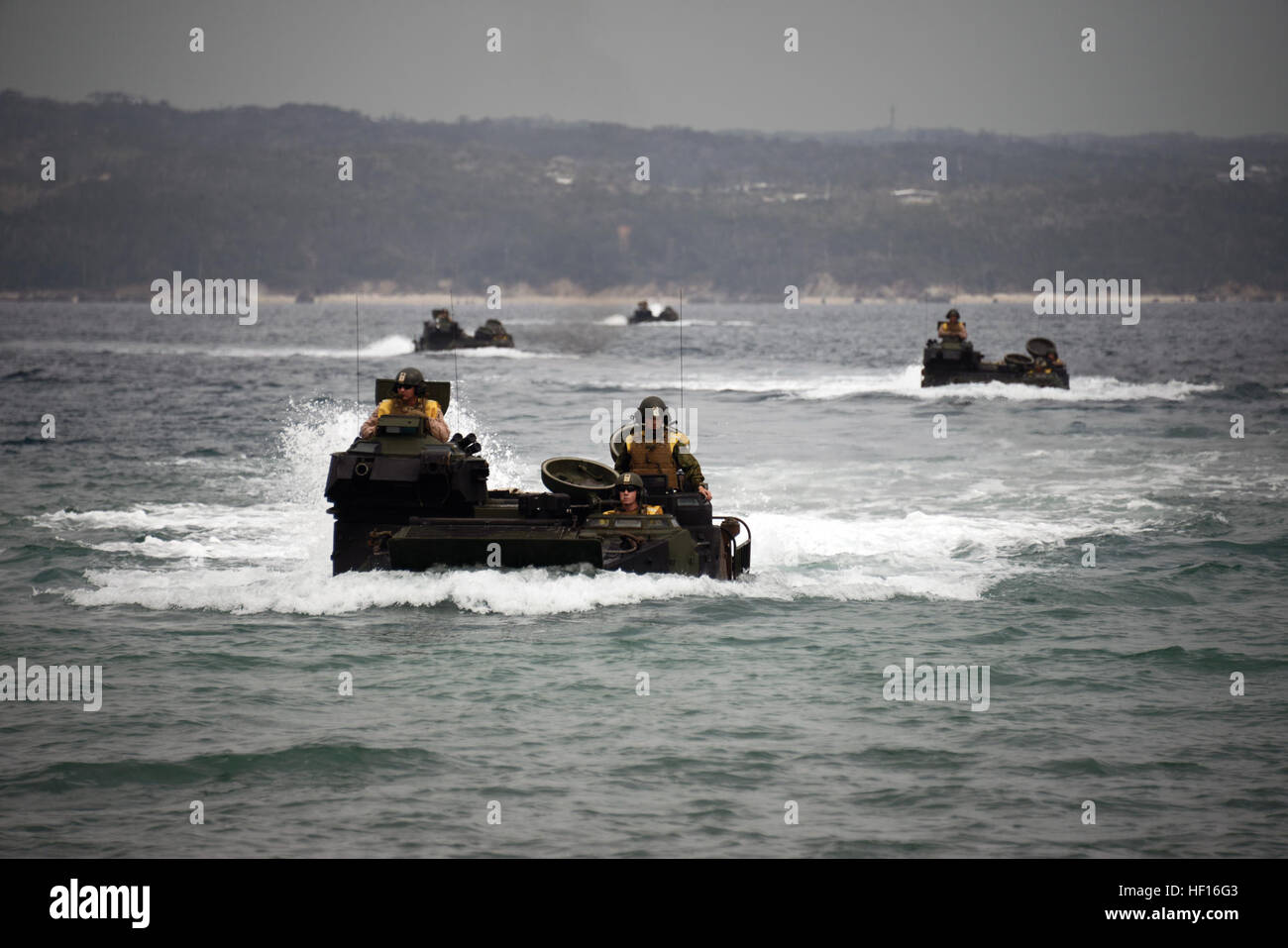 Marines maneuver assault amphibious vehicles through the water in ...