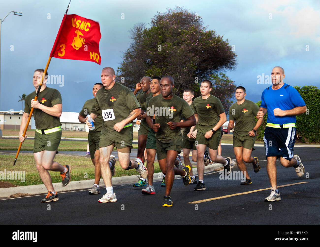 A group of 10 Marines from 3rd Marine Regiment run to the finish line ...