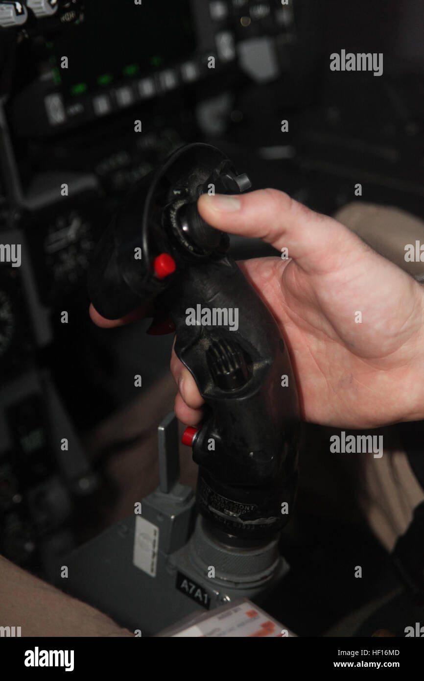 A pilot maneuvers the joystick while conducting a training flight in an ...