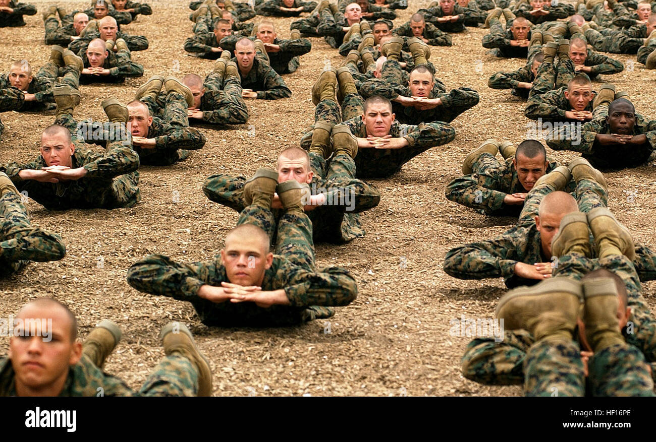 Company C recruits stretch out their abdominal muscles before a martial ...