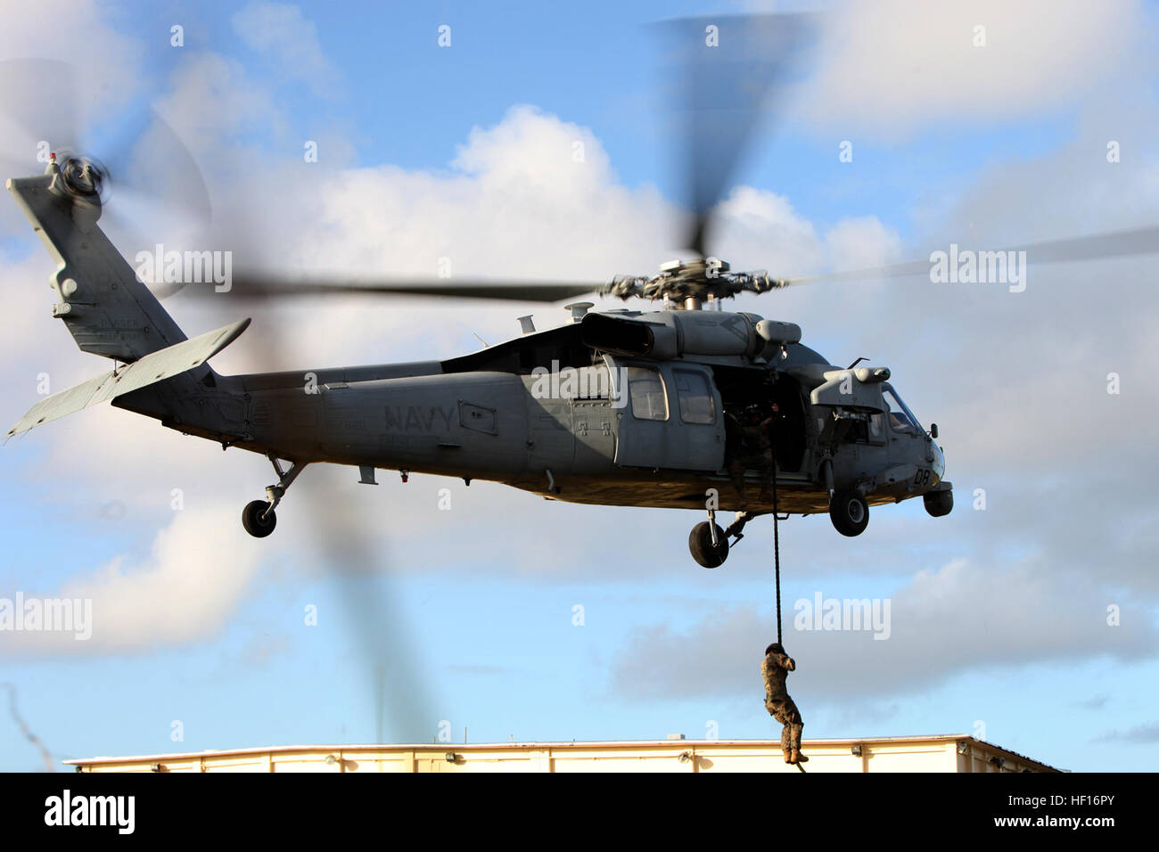 U.S. Marines fast-rope from an MH-60S Knighthawk helicopter at Naval ...