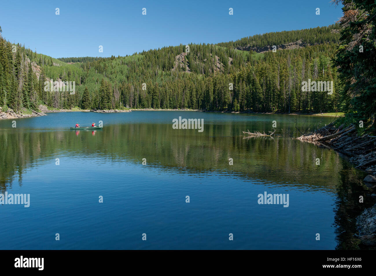 A couple fishing from a canoe on Mesa Lake, on Colorado's Grand Mesa ...