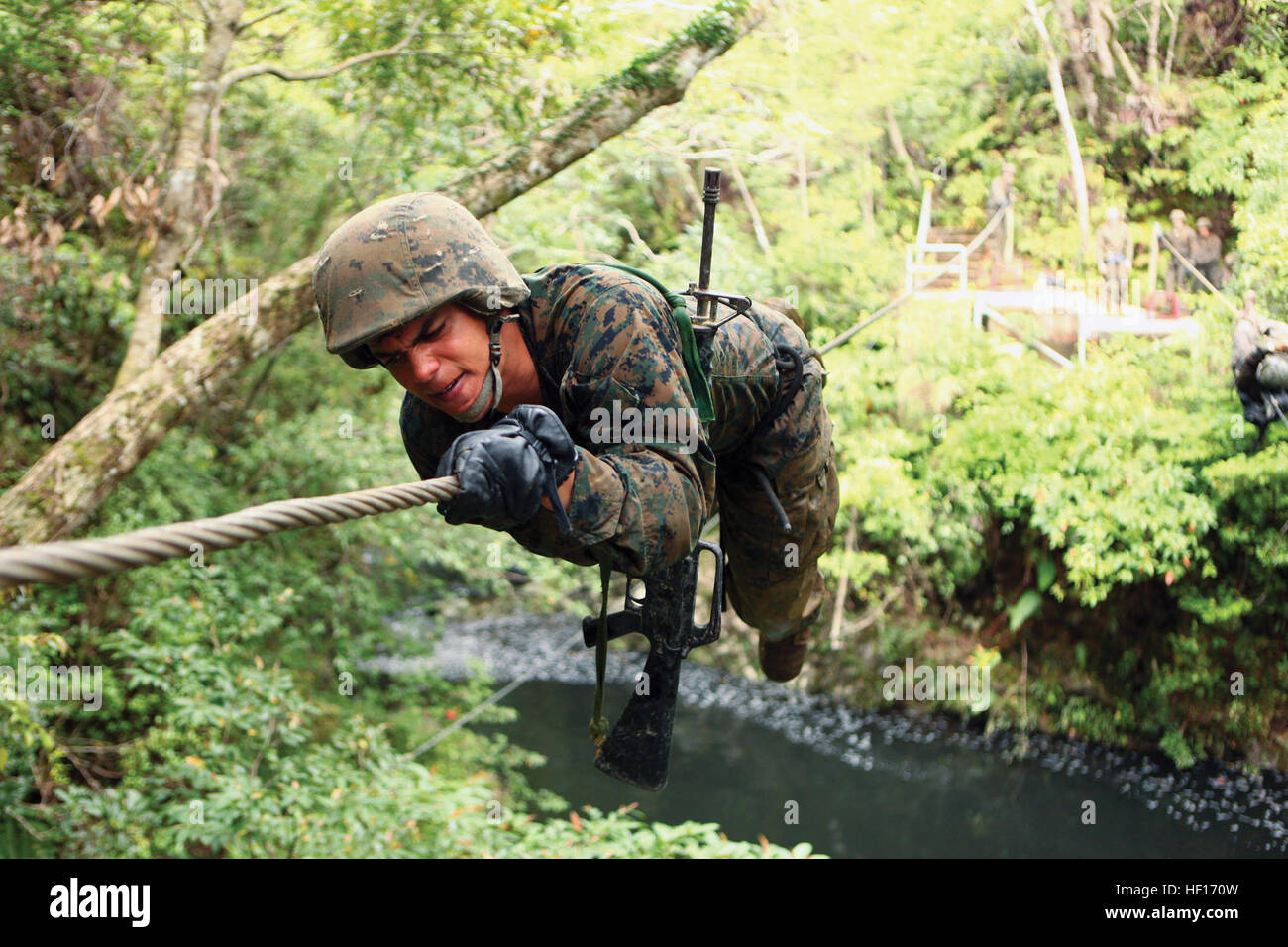 Cpl. Wilkins Vidal crosses the monkey crawl obstacle of the endurance ...