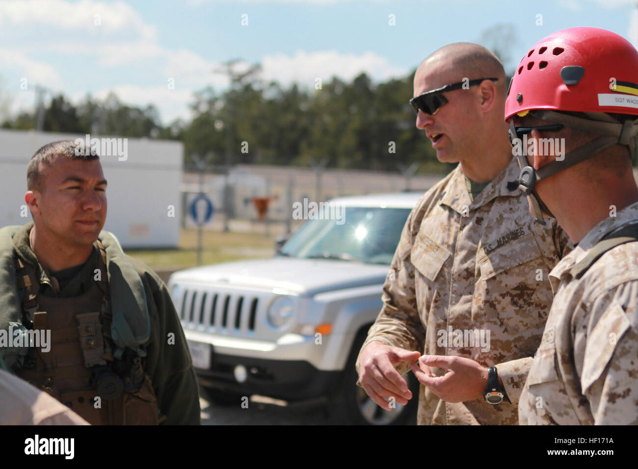 Marines with Special Operations Training Group gather a rope descending ...
