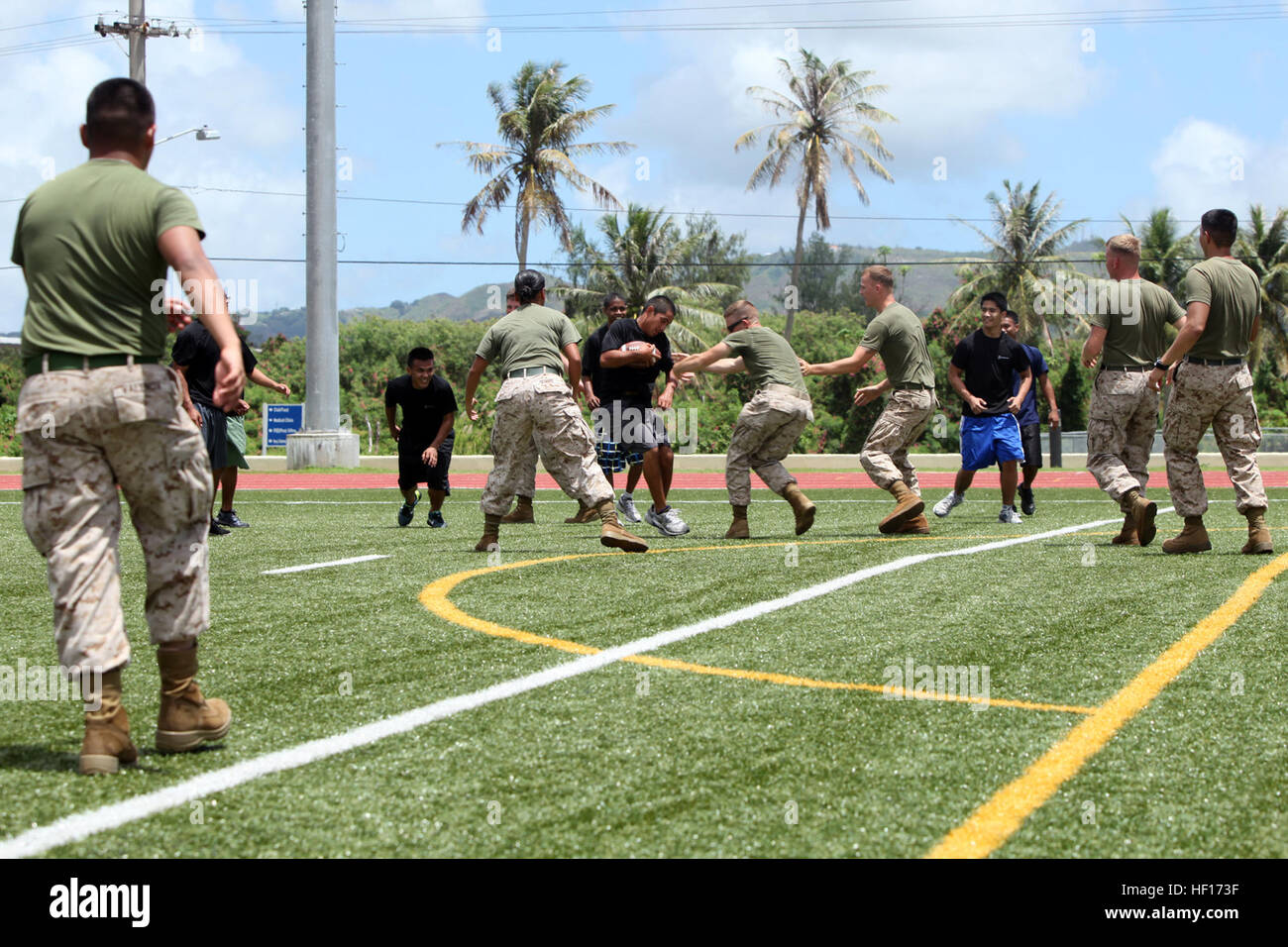 Marines participate in physical training, play football and answer ...